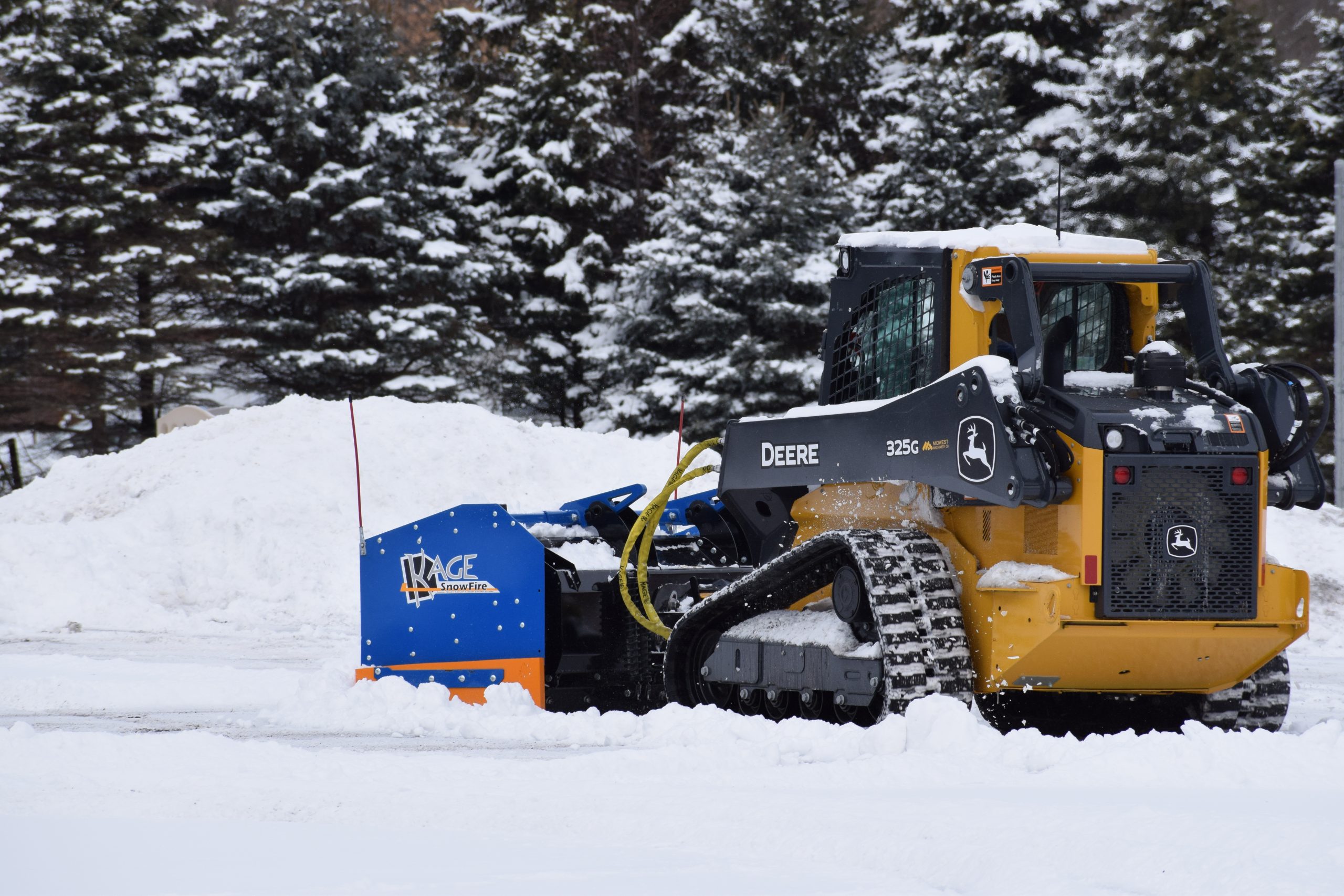 Skid Steer Snow Tires vs. Tracks and Chains For Traction